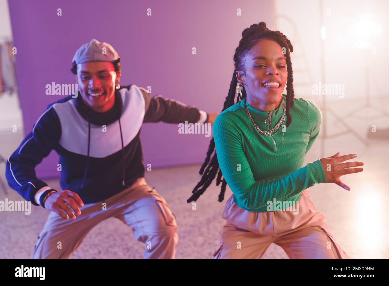 Image of happy diverse female and male hip hop dancers in studio. Dance ...