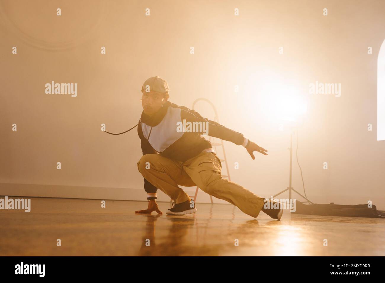 Image of biracial male modern dancer dancing in smoked interior. Dance ...