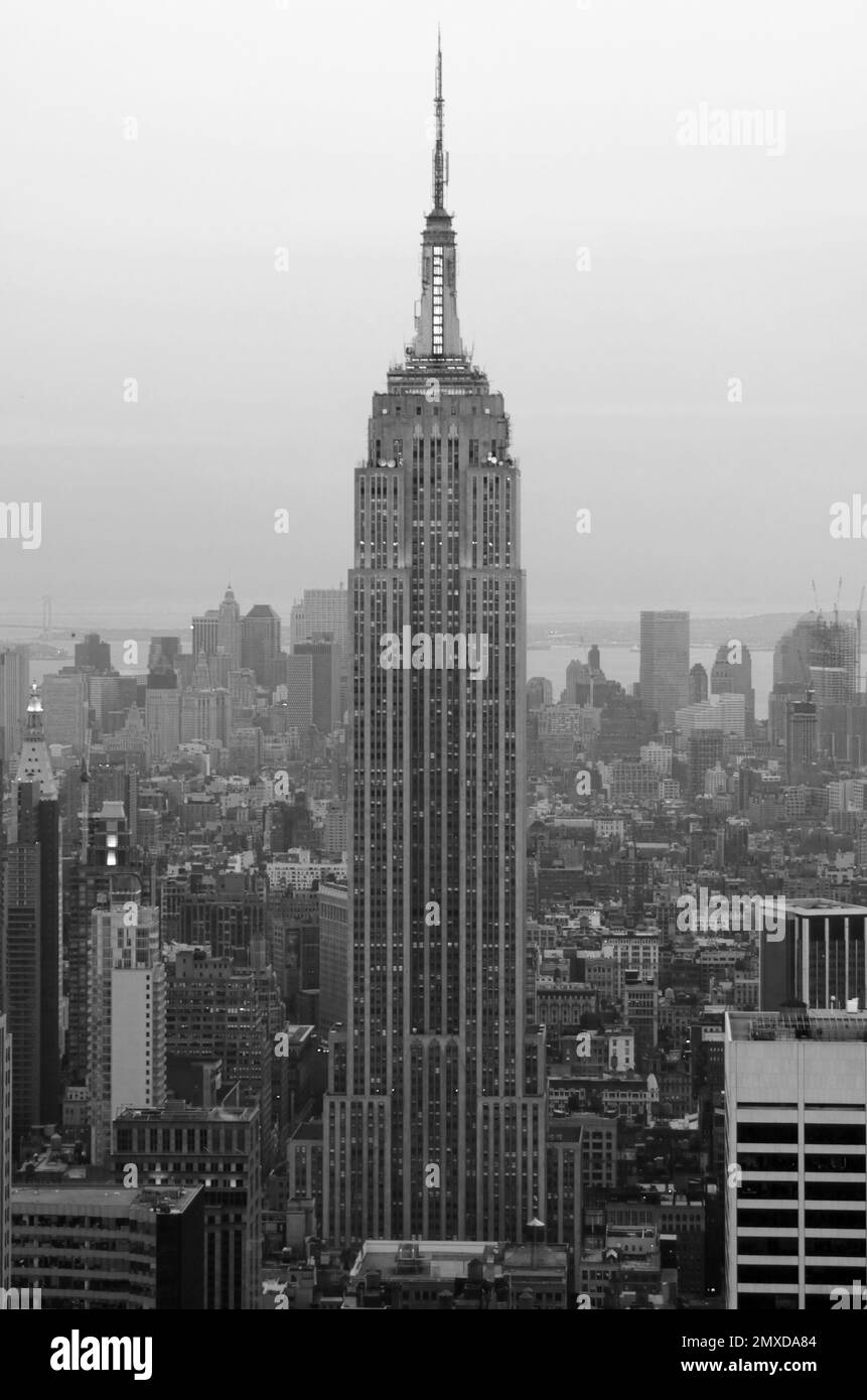 View of the Empire State Building towering above 5th Avenue, an iconic symbol of New York's ...