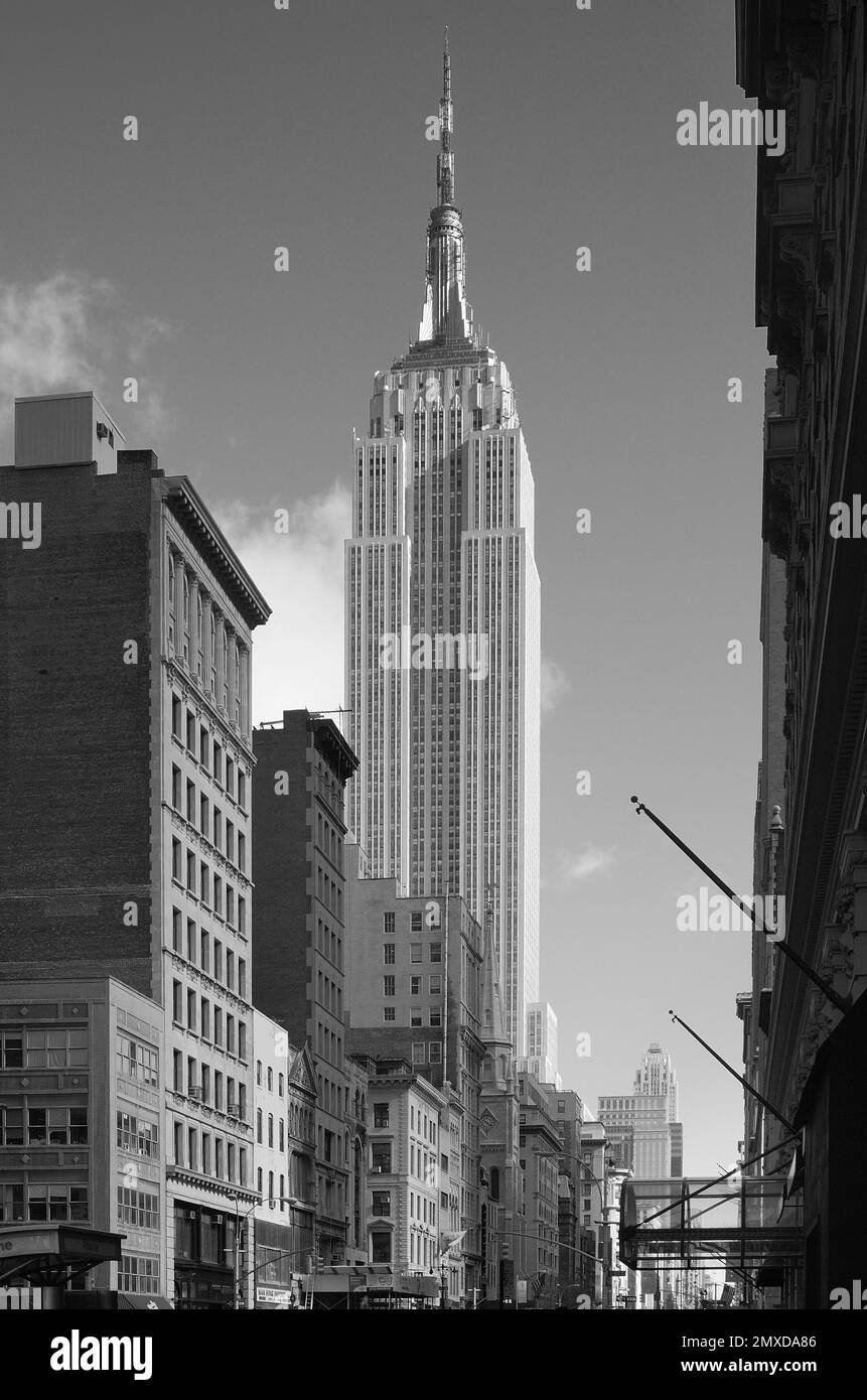 View of the Empire State Building towering above 5th Avenue, an iconic symbol of New York's ...