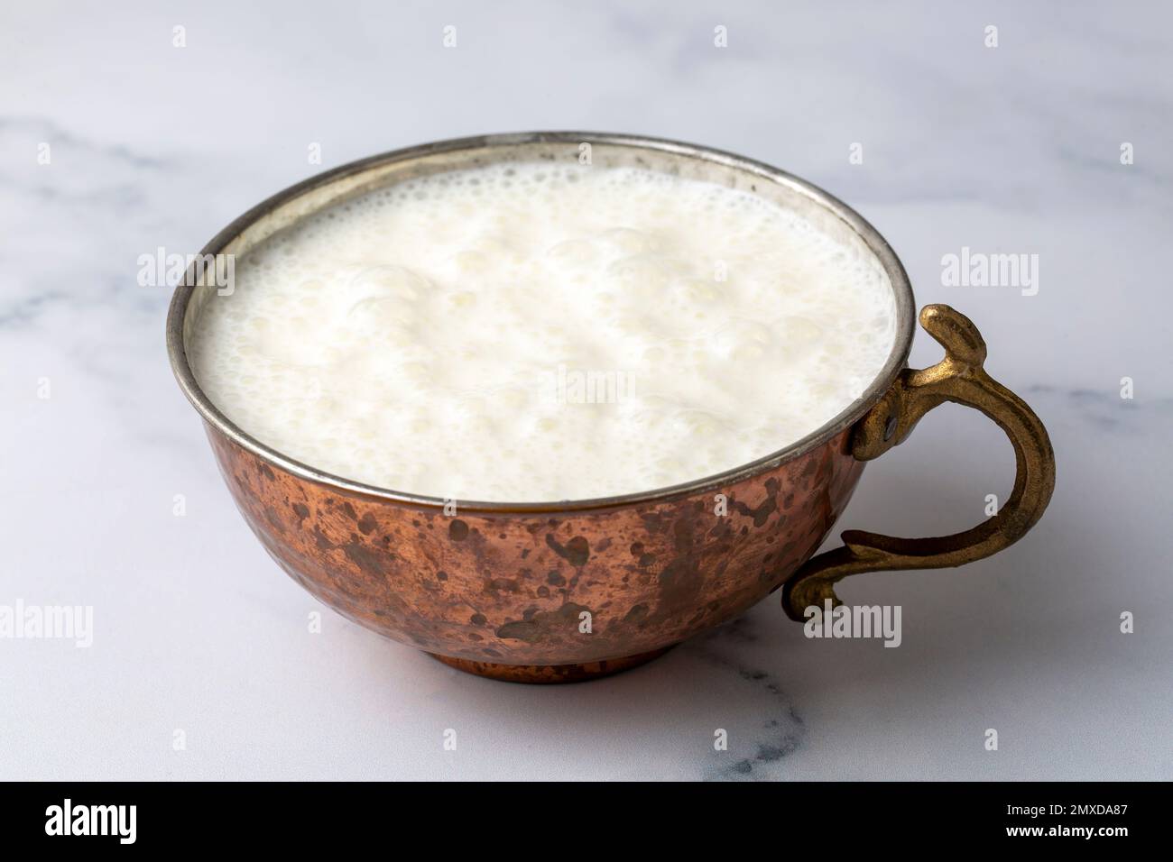 Ayran - Traditional Turkish yoghurt drink in a copper cup Stock Photo ...