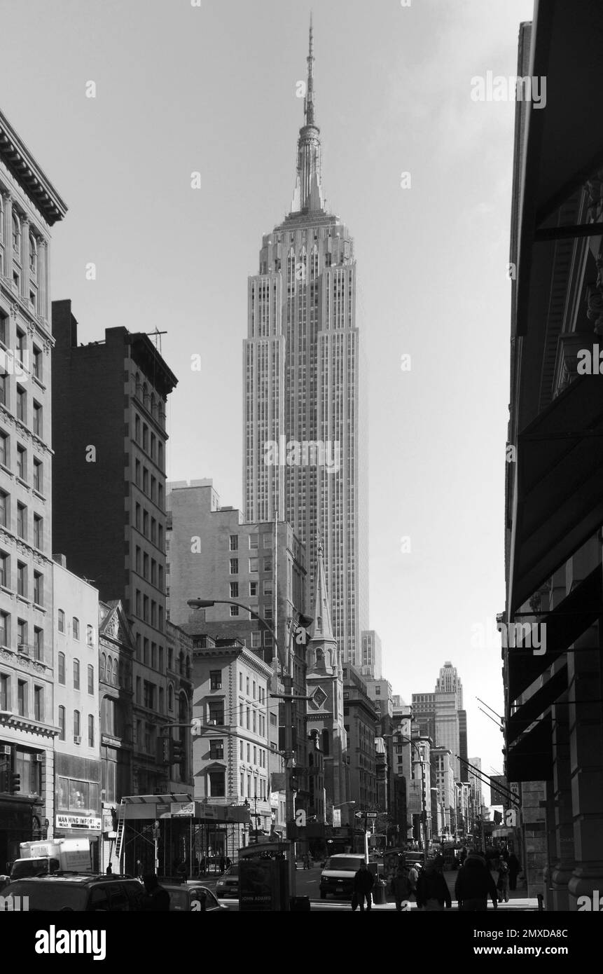 View of the Empire State Building towering above 5th Avenue, an iconic symbol of New York's ...
