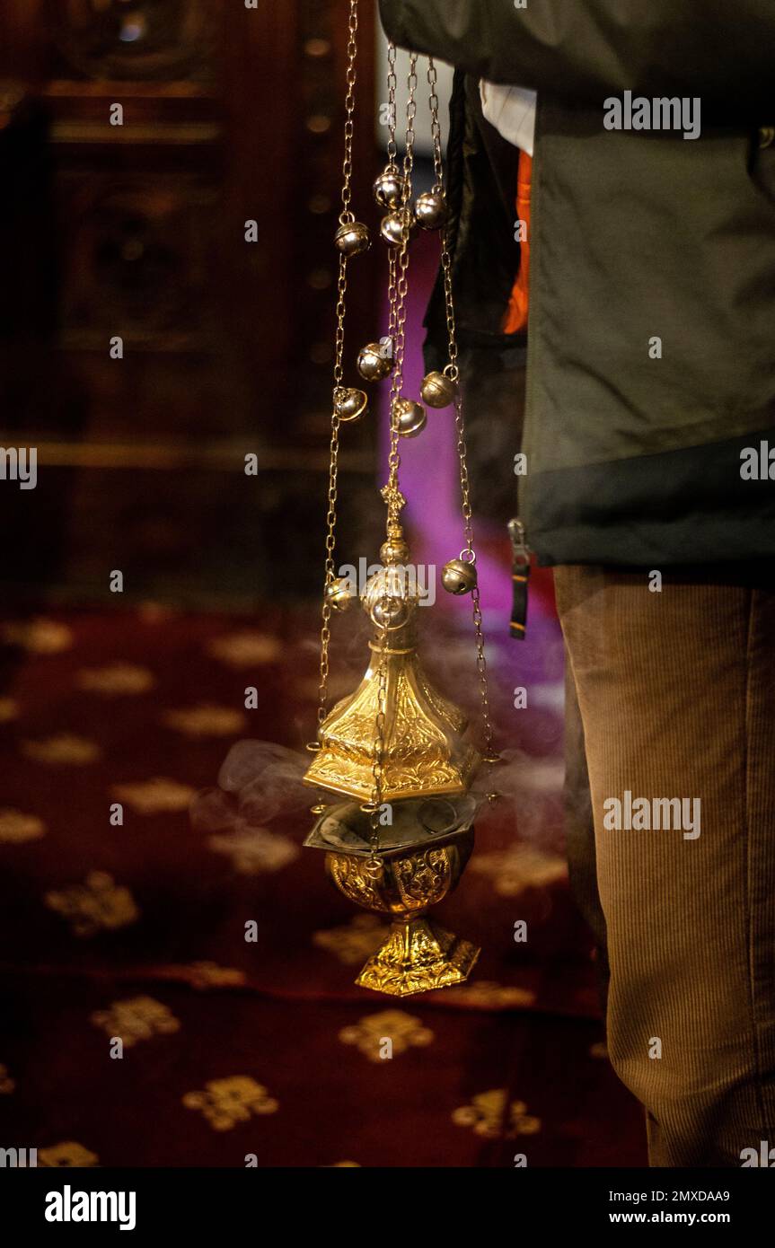 A Thurible smoking in the church, vertical Stock Photo - Alamy