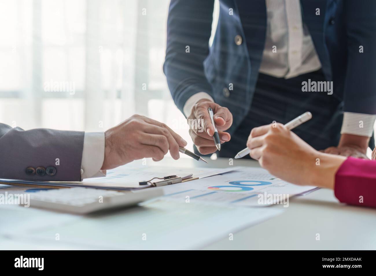 Close up of Diverse colleagues gather brainstorm discuss financial ...
