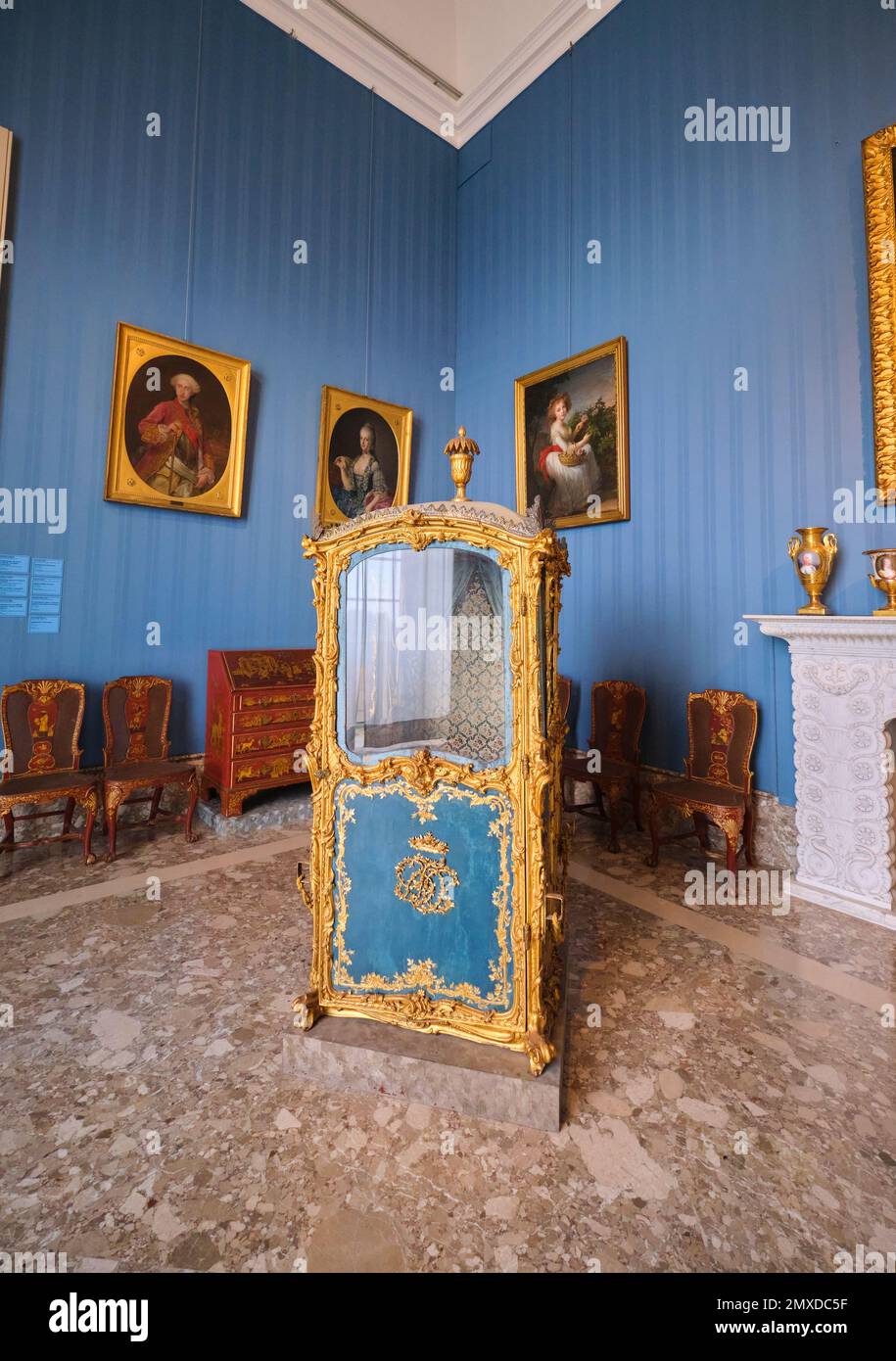 A fancy, gold, period wheelless vehicle, litter, lectica. At the art ...