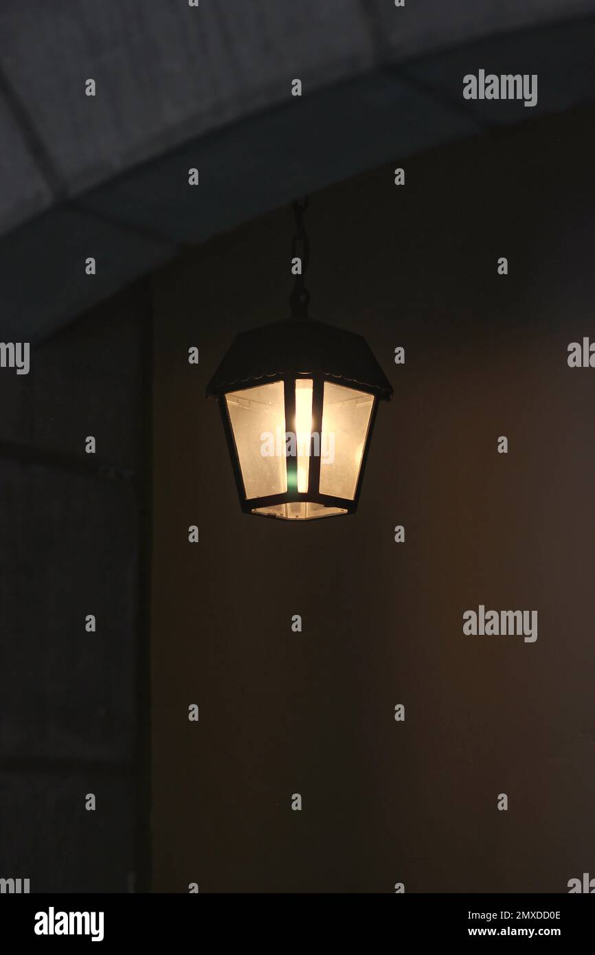 Medieval lantern hanging and glowing bright light in the darkness Stock ...