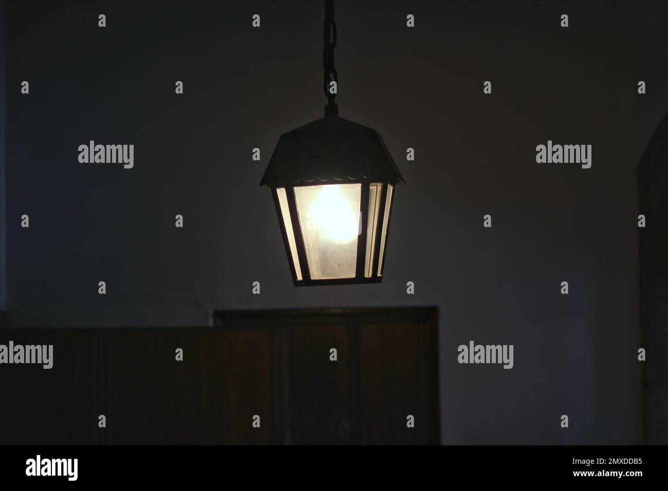 Medieval lantern hanging and glowing bright light in the darkness Stock ...