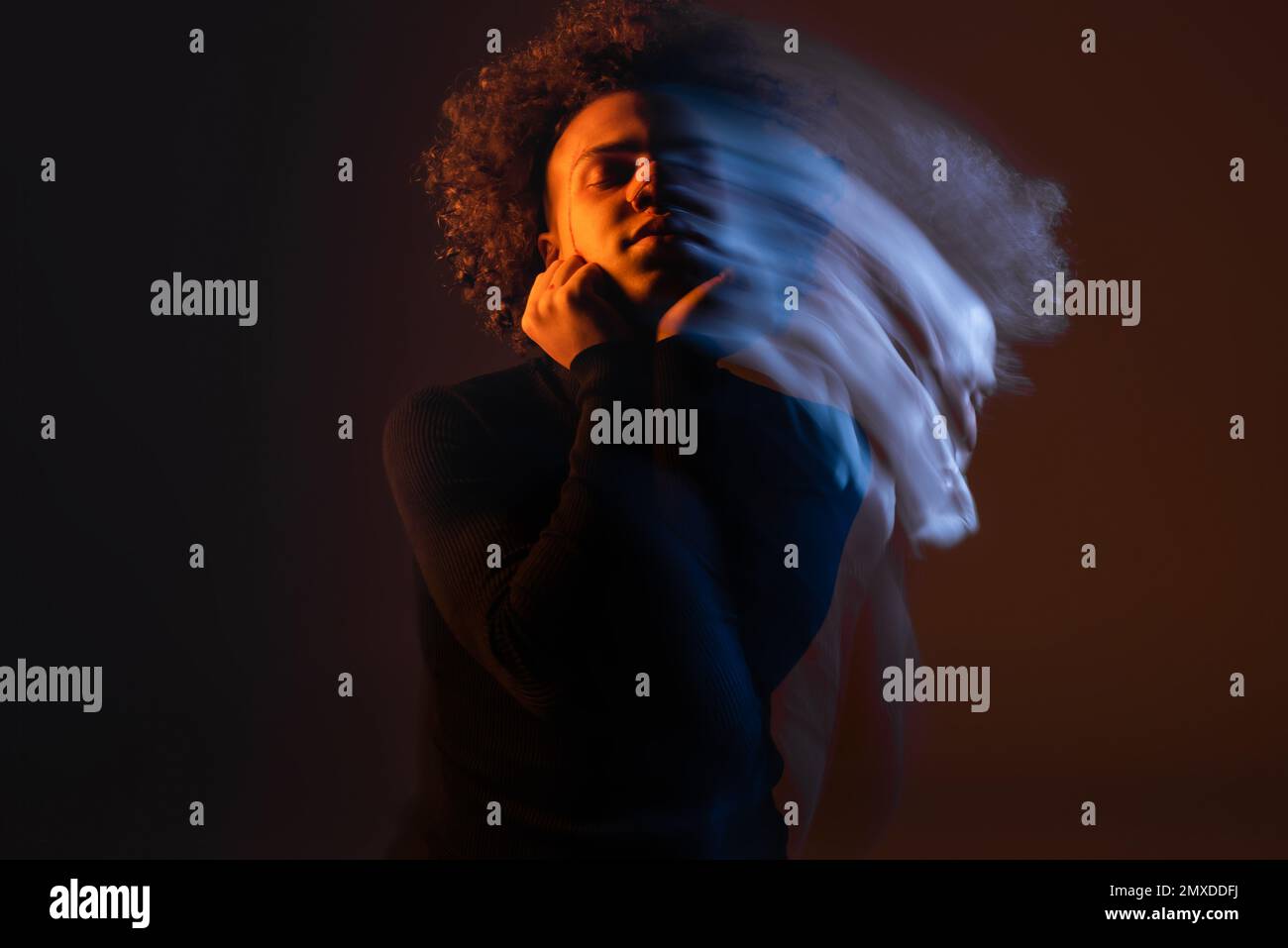 double exposure of injured african american man with hands near ...