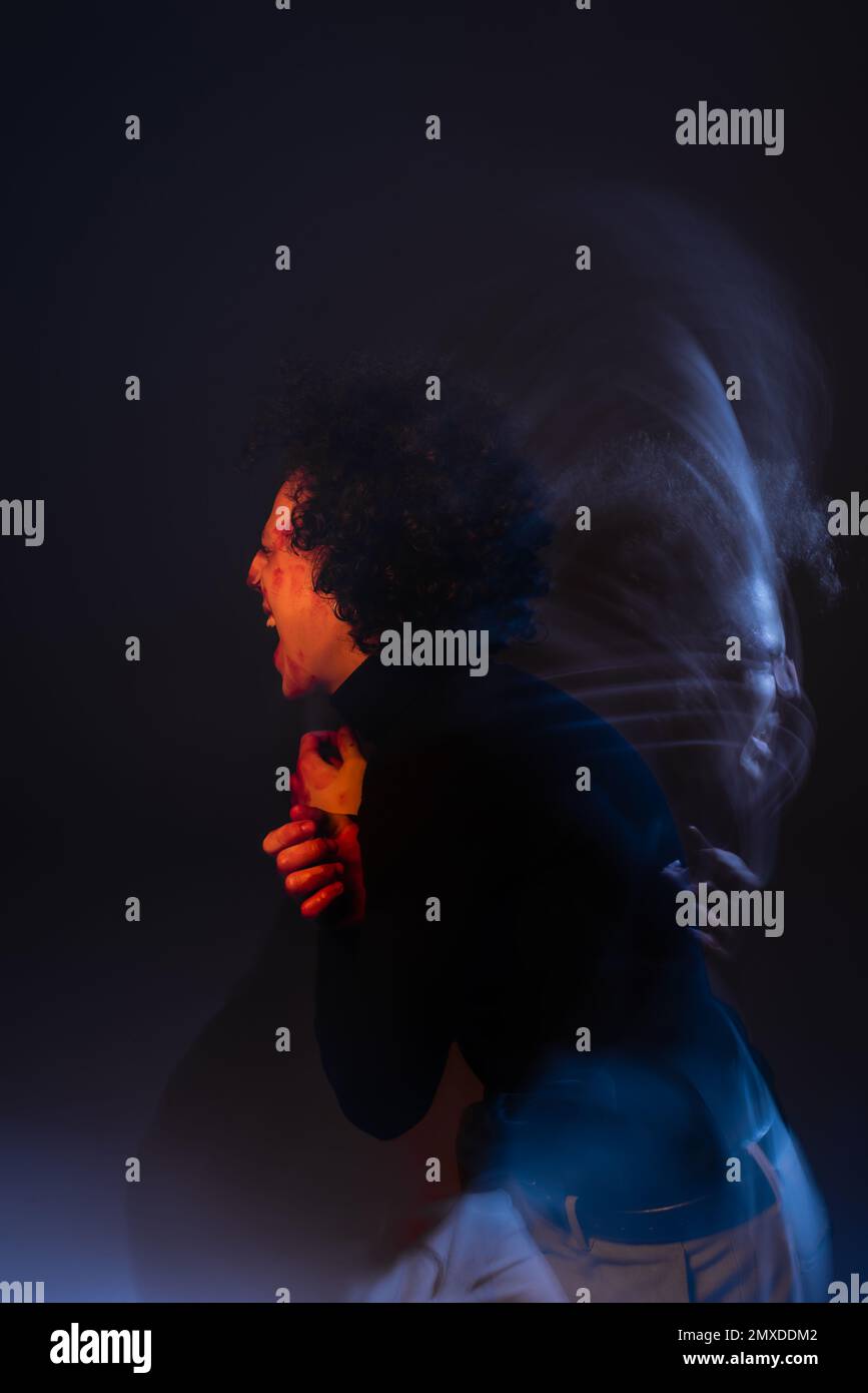 double exposure of wounded and angry african american man shouting on ...