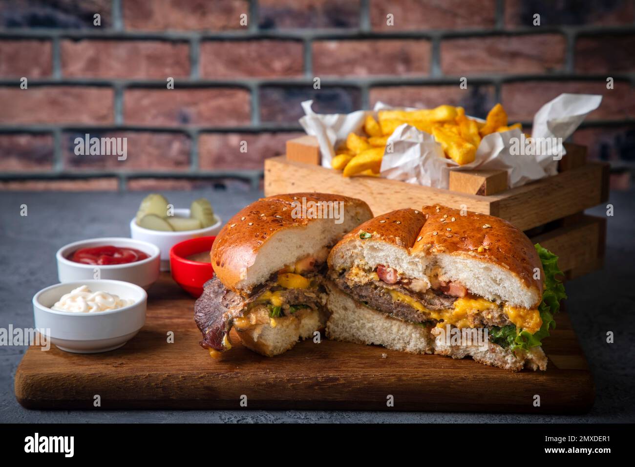 Homemade hamburger served with french fries. It looks delicious ...