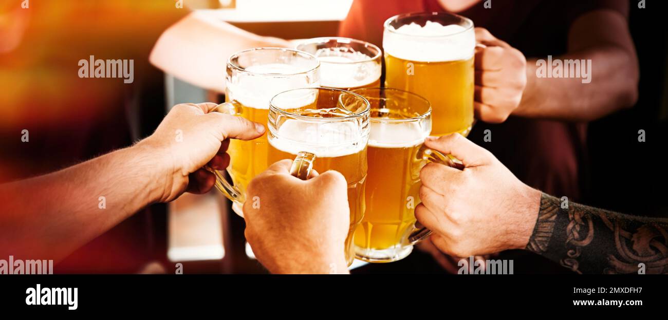 Group of friends toasting with beer in pub, closeup. Banner design ...