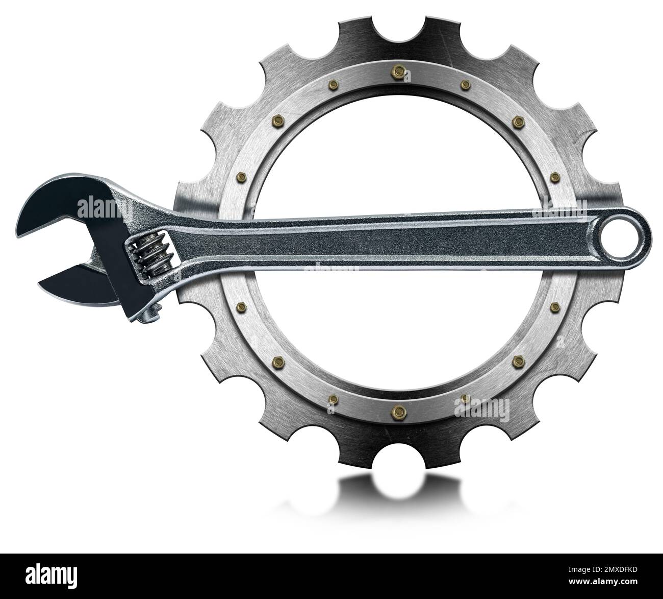 Closeup of a modern stainless steel adjustable wrench on a metal gear ...
