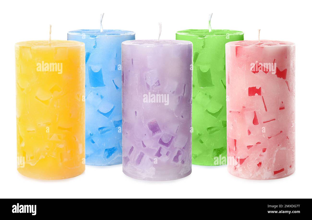 Set of color wax candles on white background Stock Photo - Alamy