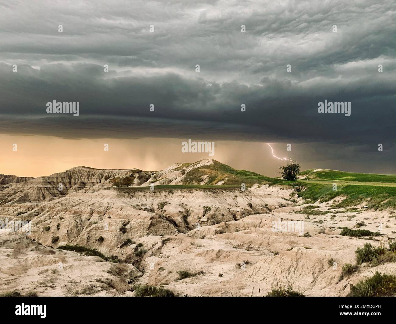 A severe thunderstorm and lightning striking the Badlands National Park ...
