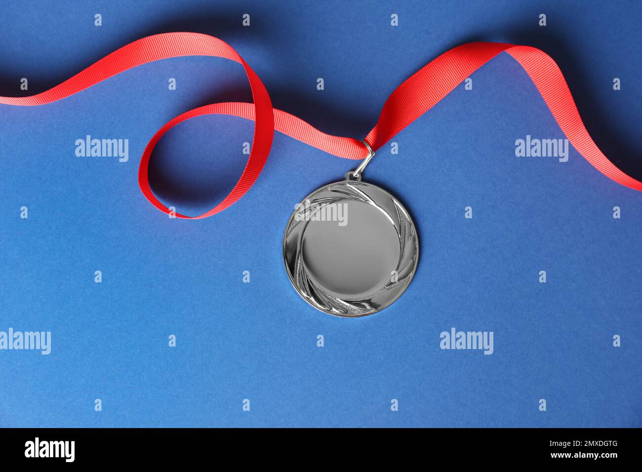 Silver medal on blue background, top view. Space for design Stock Photo ...