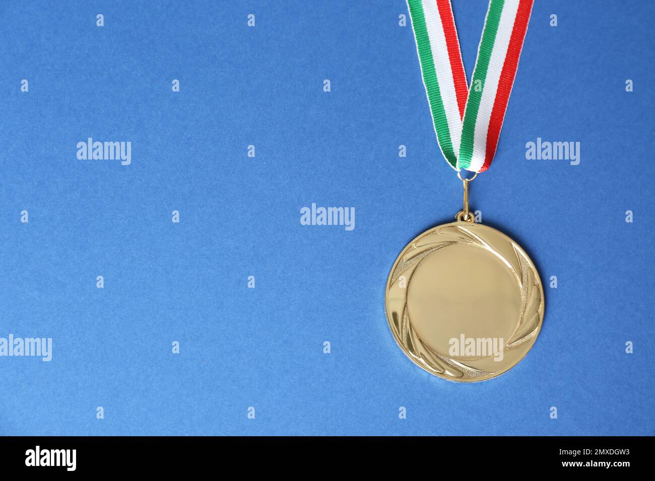 Gold medal on blue background, top view. Space for design Stock Photo ...