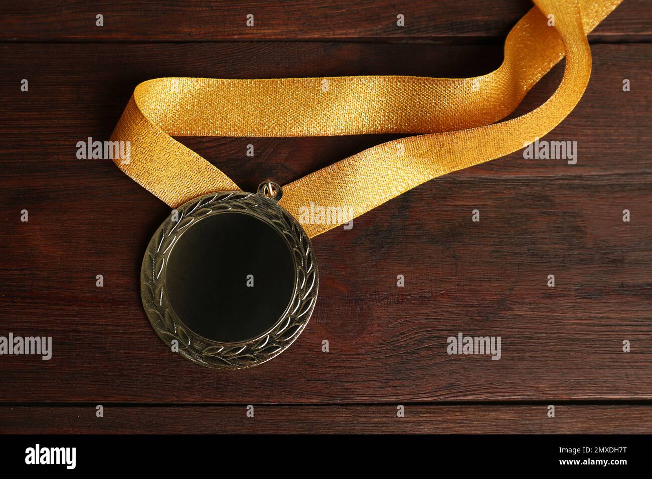 Gold medal on wooden background, top view. Space for design Stock Photo ...