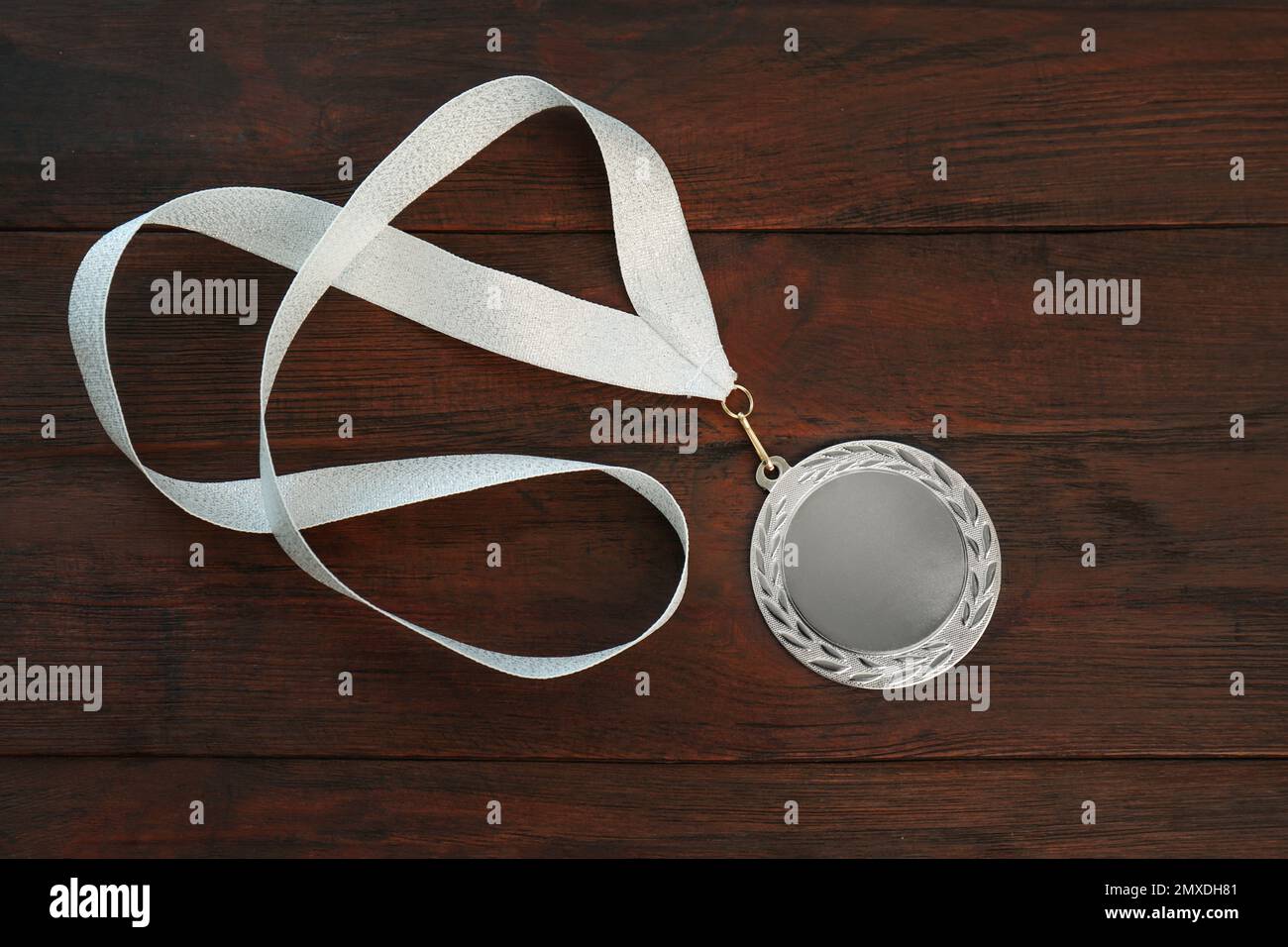 Silver medal on wooden background, top view. Space for design Stock ...