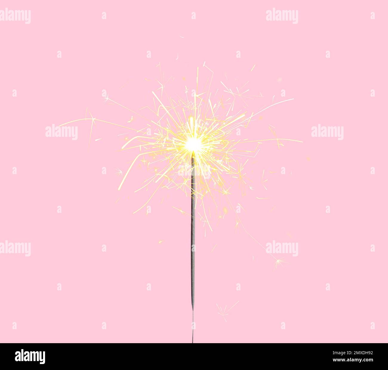 Beautiful sparkler burning on pink background. Party decor Stock Photo ...