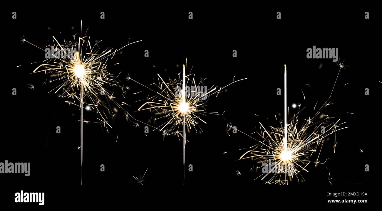 Set of burning sparklers on black background. Banner design Stock Photo ...