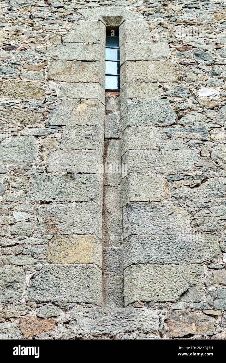Old medieval window surrounded by stone wall in castle attracts ...