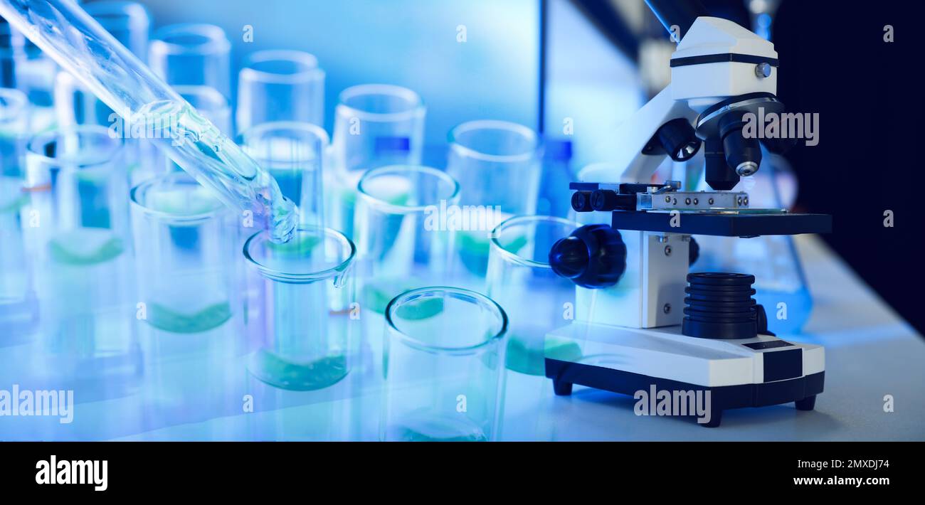 Double exposure of test tubes with samples and microscope, banner ...