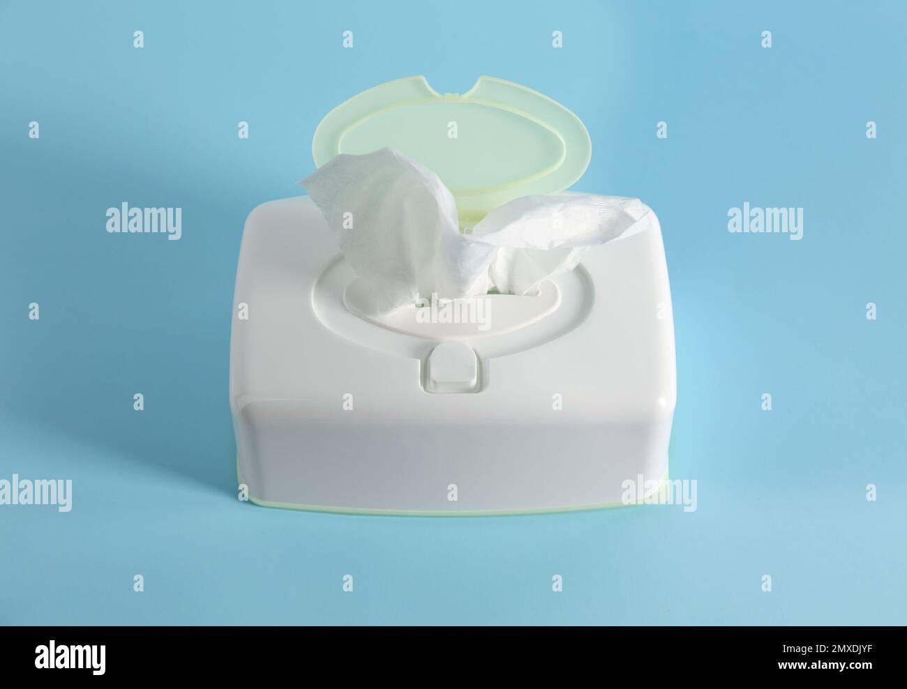 Box of paper tissues on light blue background Stock Photo - Alamy