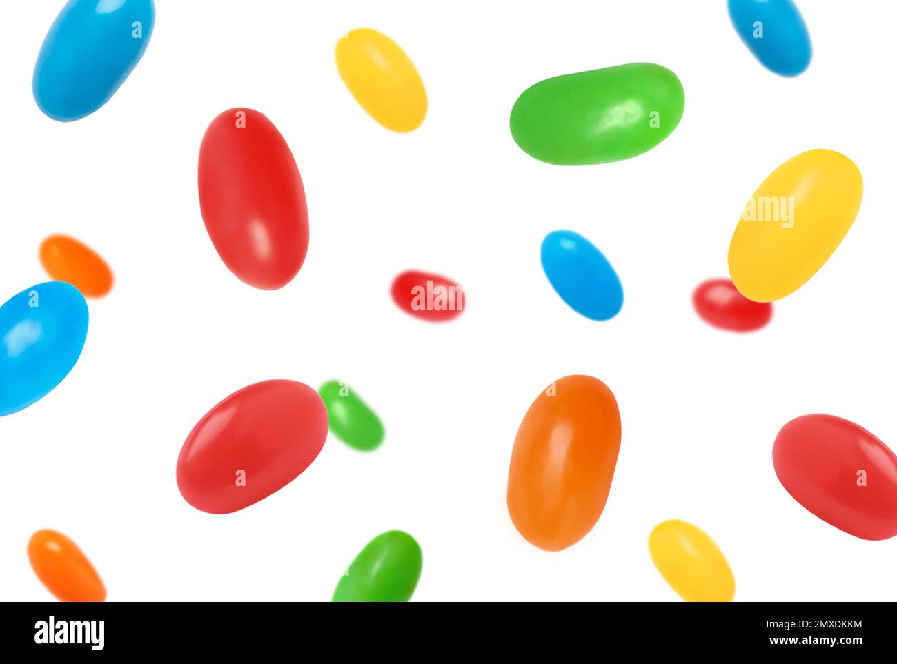 Delicious color jelly beans falling on white background Stock Photo - Alamy