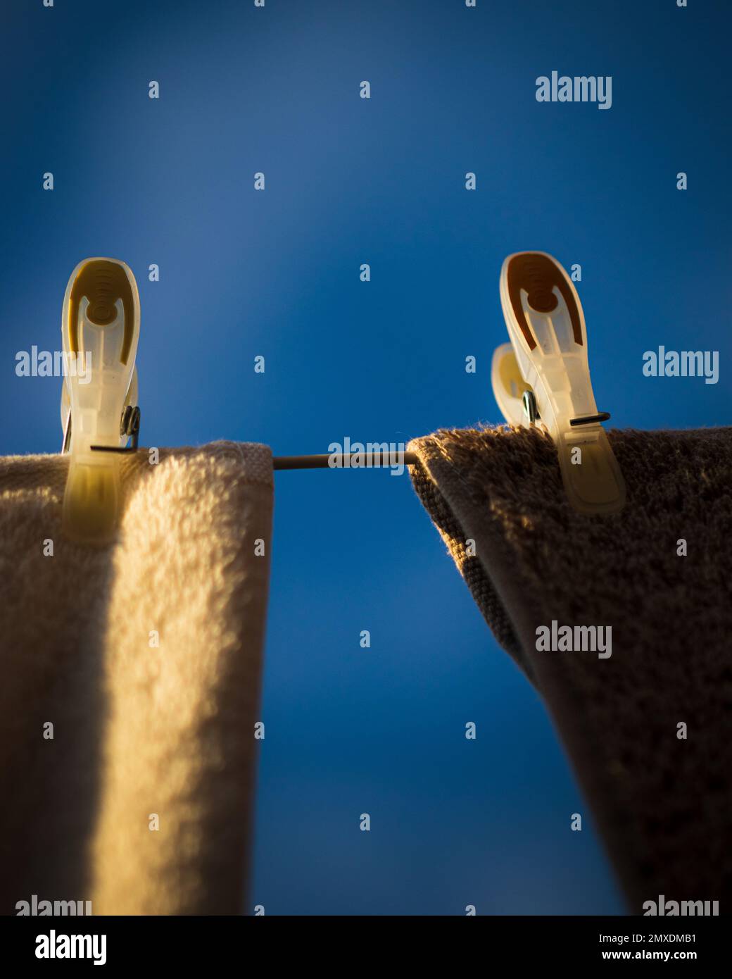 A closeup shot of the clothes peg holding the clean towels on washing ...