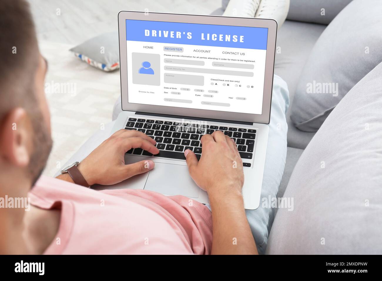 Man filling in driver's license form online on website using laptop, closeup Stock Photo - Alamy