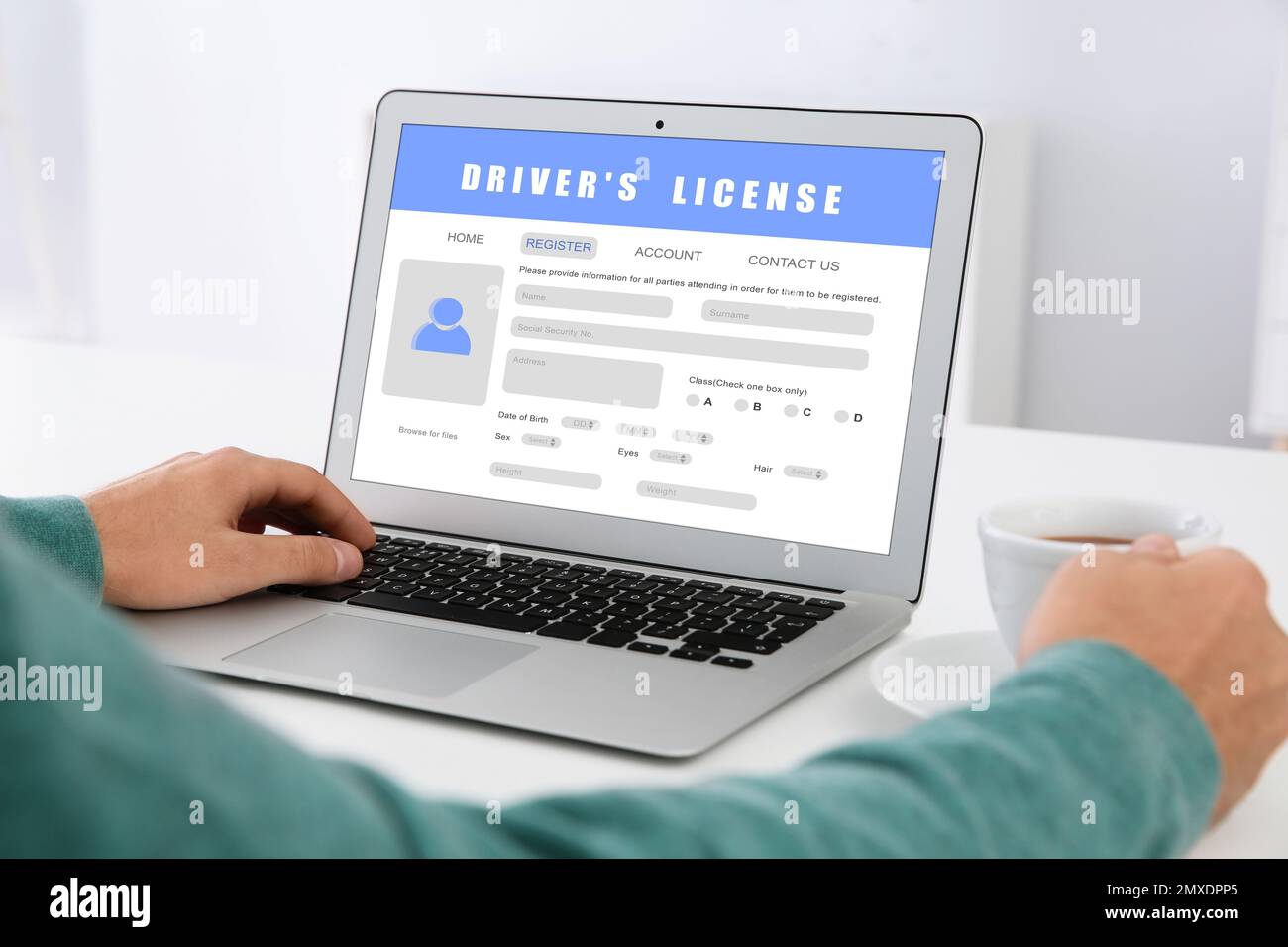 Man filling in driver's license form online on website using laptop, closeup Stock Photo - Alamy