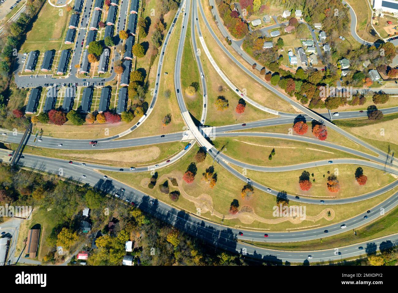 Aerial view of american freeway intersection with fast moving cars and ...
