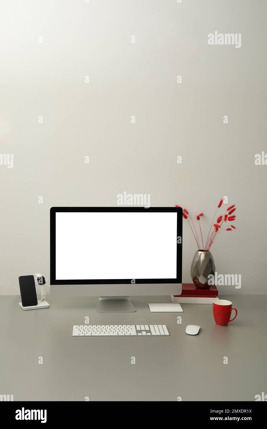 Modern workplace with computer and charging devices. Interior design ...