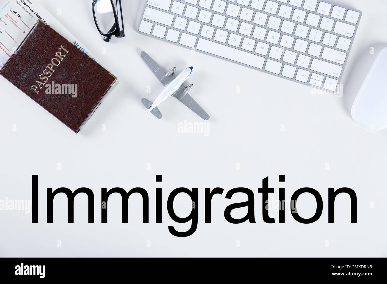 Flat lay composition with airplane model and computer keyboard on light ...