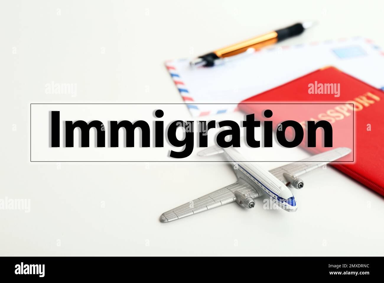 Toy plane and passport on white background. Immigration concept Stock ...