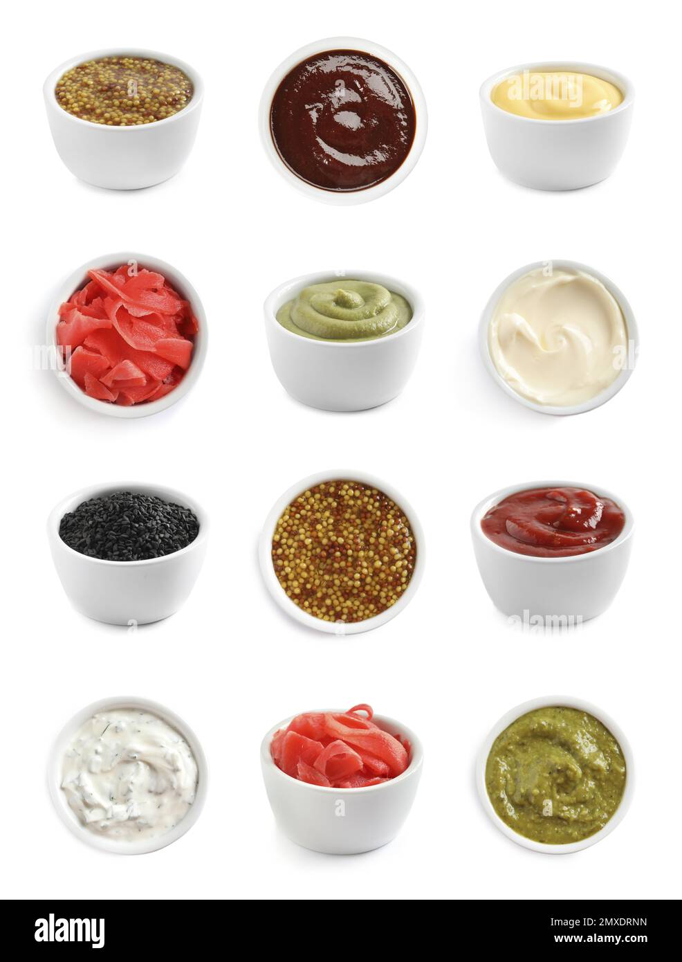 Set of different delicious sauces and condiments on white background ...