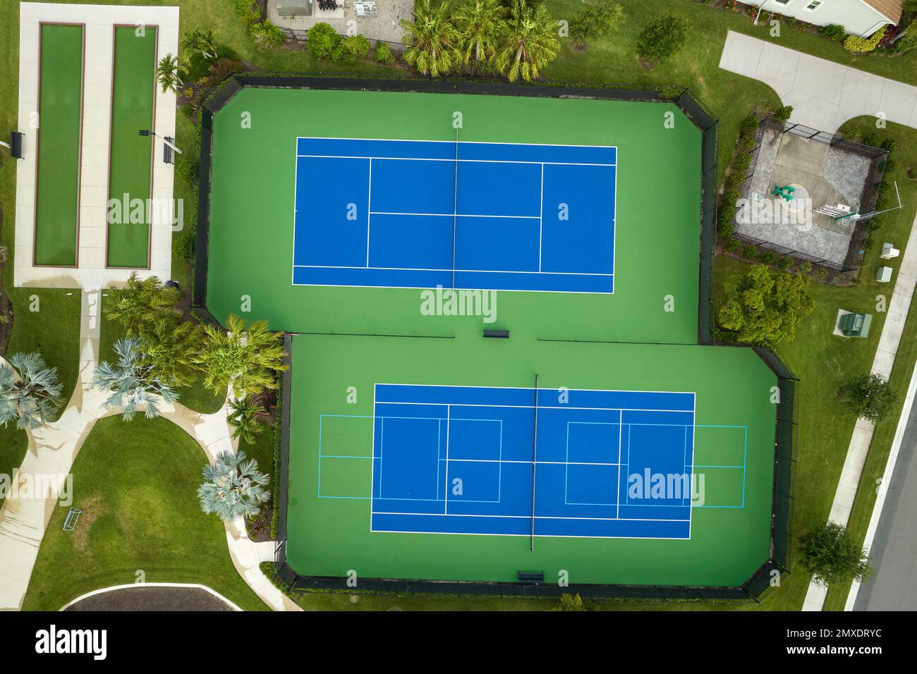 Aerial view of blue tennis courts for sports recreational activity ...