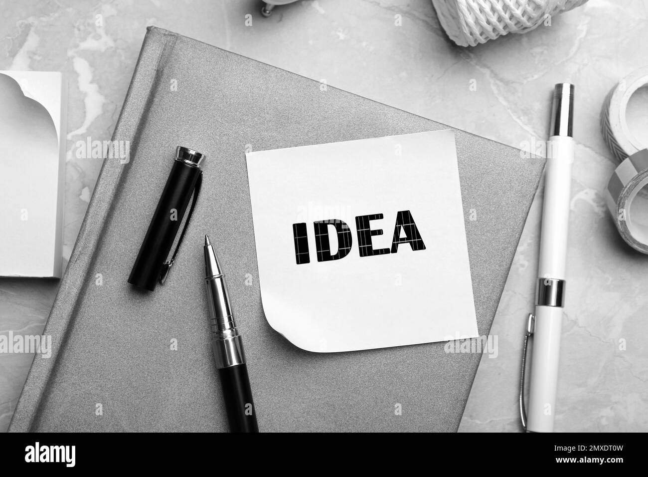 Note with word IDEA and stationery on grey marble table, flat lay Stock ...
