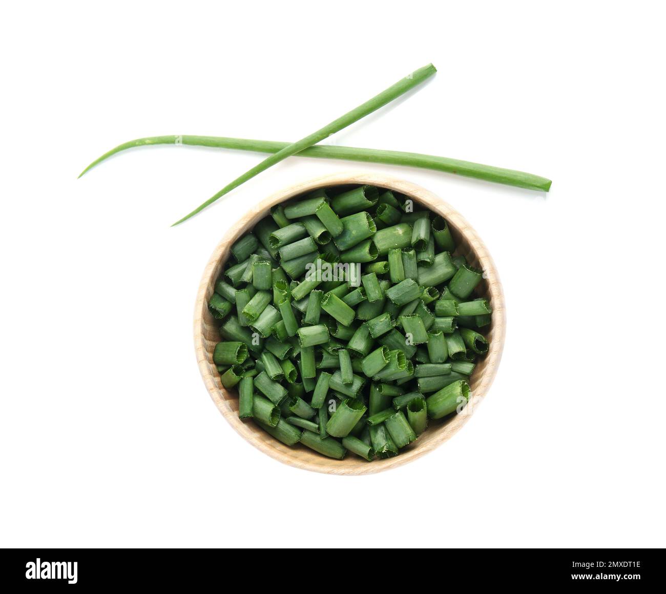 Cut green spring onion in wooden bowl isolated on white, top view Stock ...