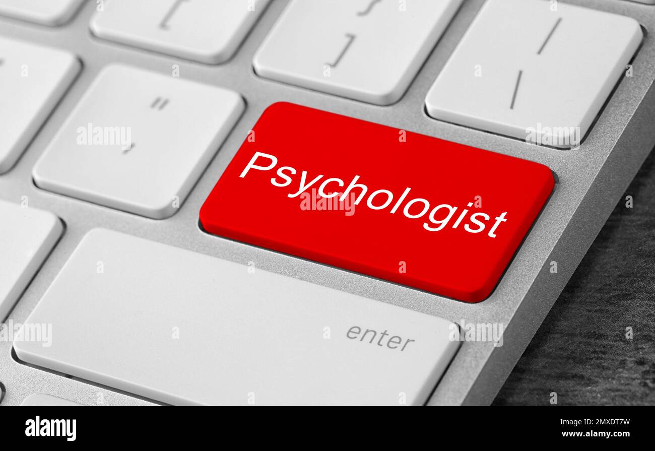Modern computer keyboard with word PSYCHOLOGIST on table, closeup Stock ...