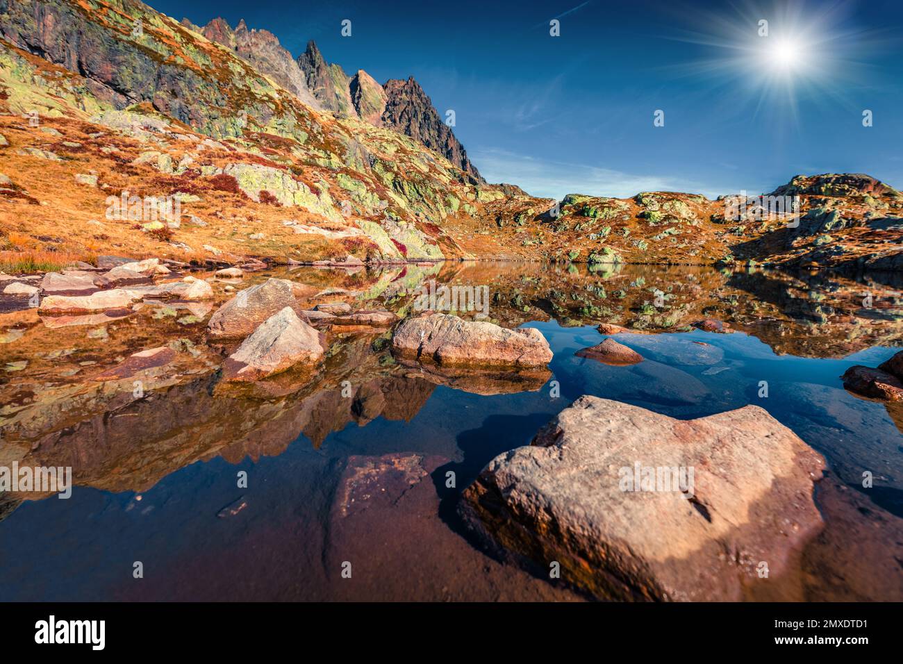 Alps mountain range feflected in calm water of Chesery lake/Lac De ...