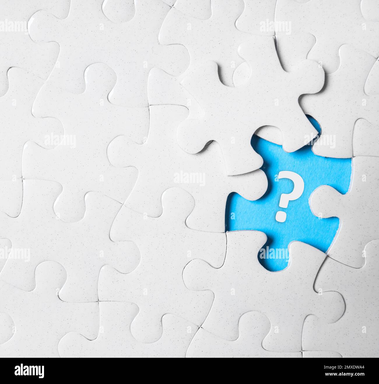 White puzzle with missing piece and question mark on white background ...