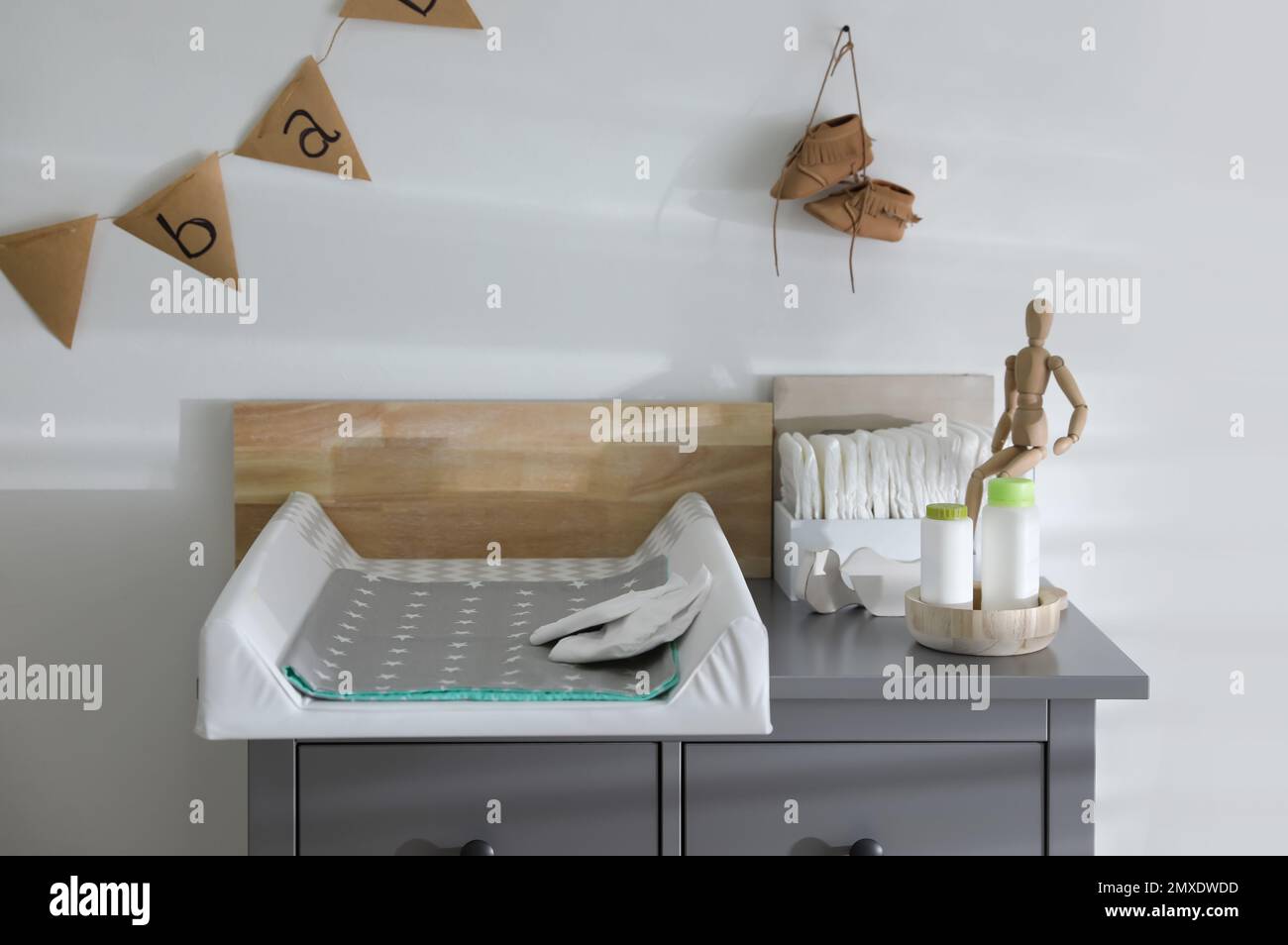 Modern changing table in baby room interior Stock Photo - Alamy