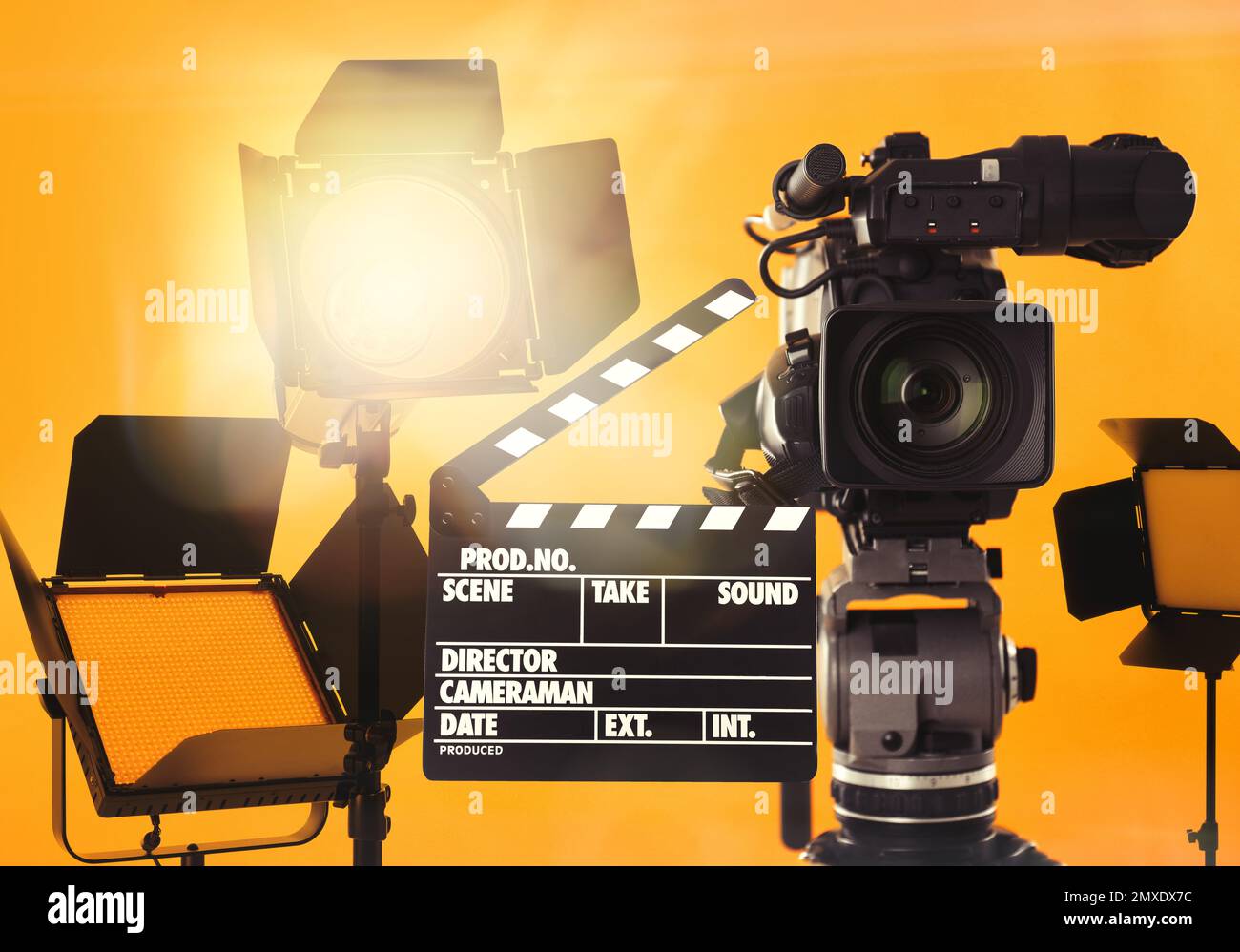 Modern professional video camera and lighting equipment in studio Stock ...