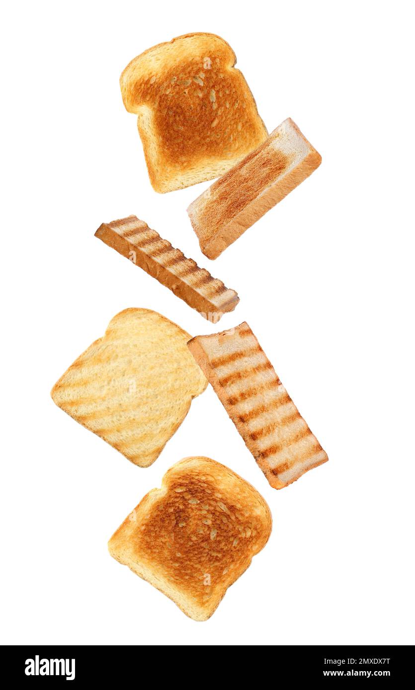 Tasty toasts falling on white background Stock Photo - Alamy