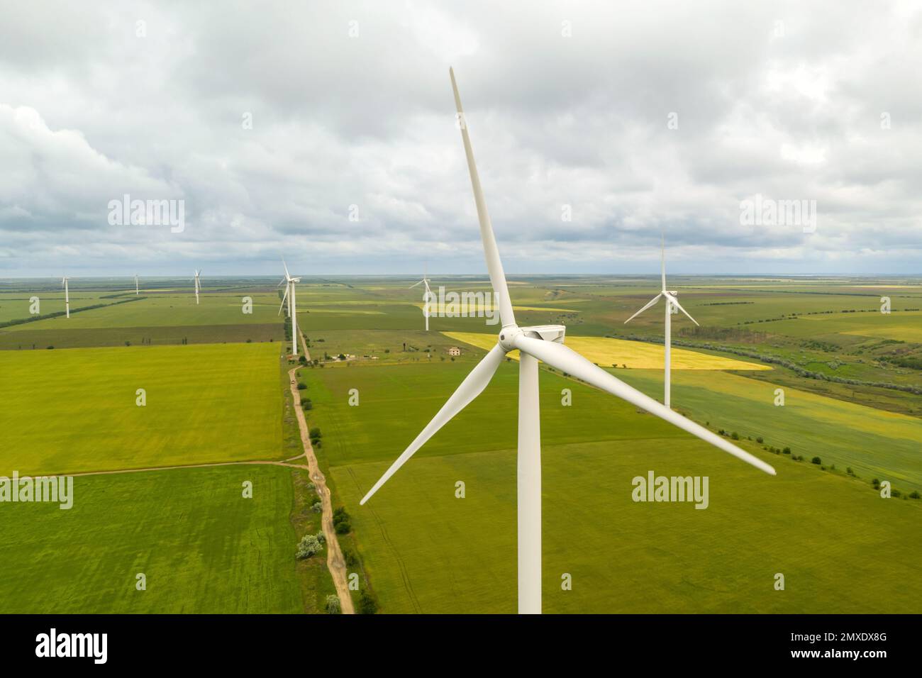 Aerial view of wind turbines in field on cloudy day Stock Photo - Alamy