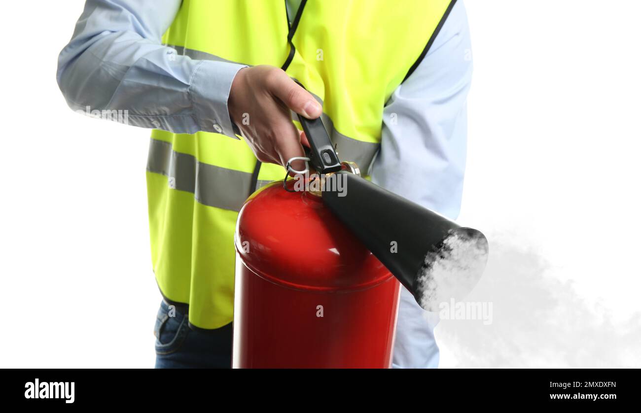 Worker using fire extinguisher on white background, closeup Stock Photo ...