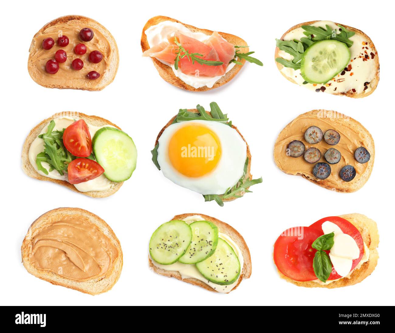 Set of toasted bread with different toppings on white background, top ...