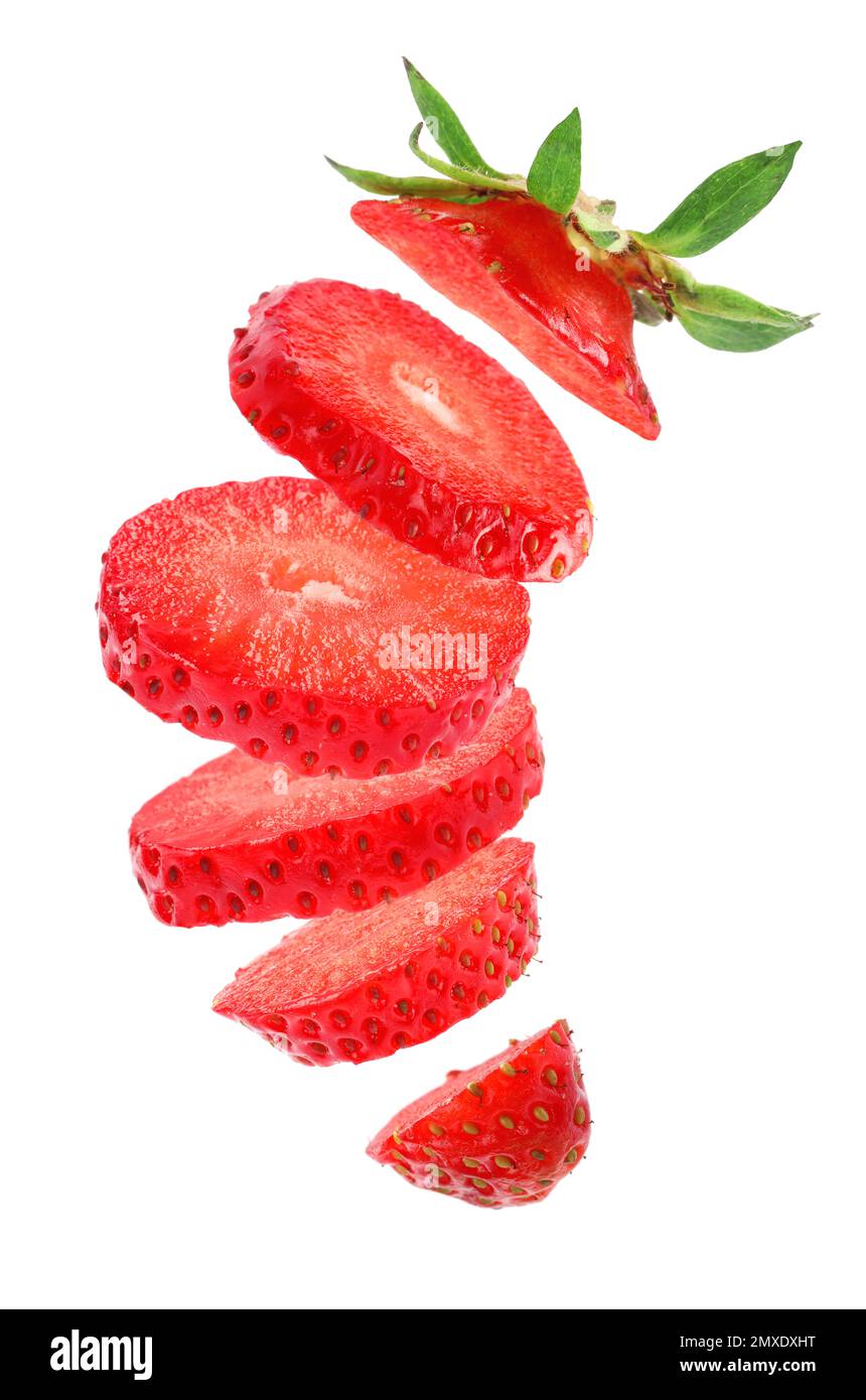 Pieces of ripe strawberry falling on white background Stock Photo - Alamy