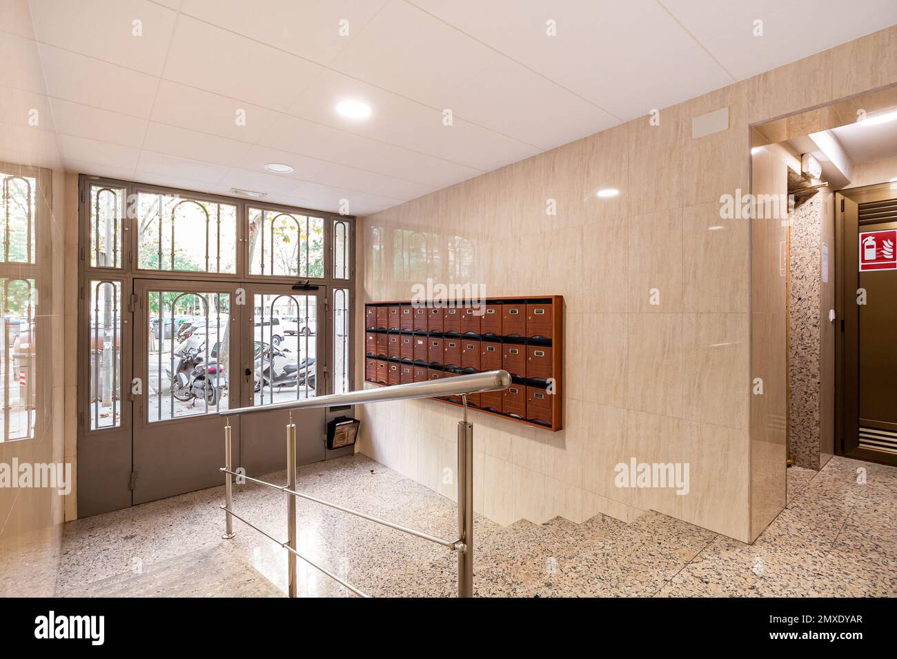 Lobby at entrance of house with long corridor, stairs to the elevator ...